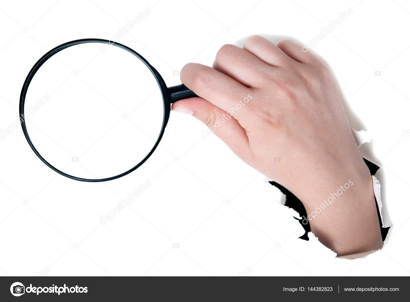 Female hand holding the magnifying glass isolated on white backg ...