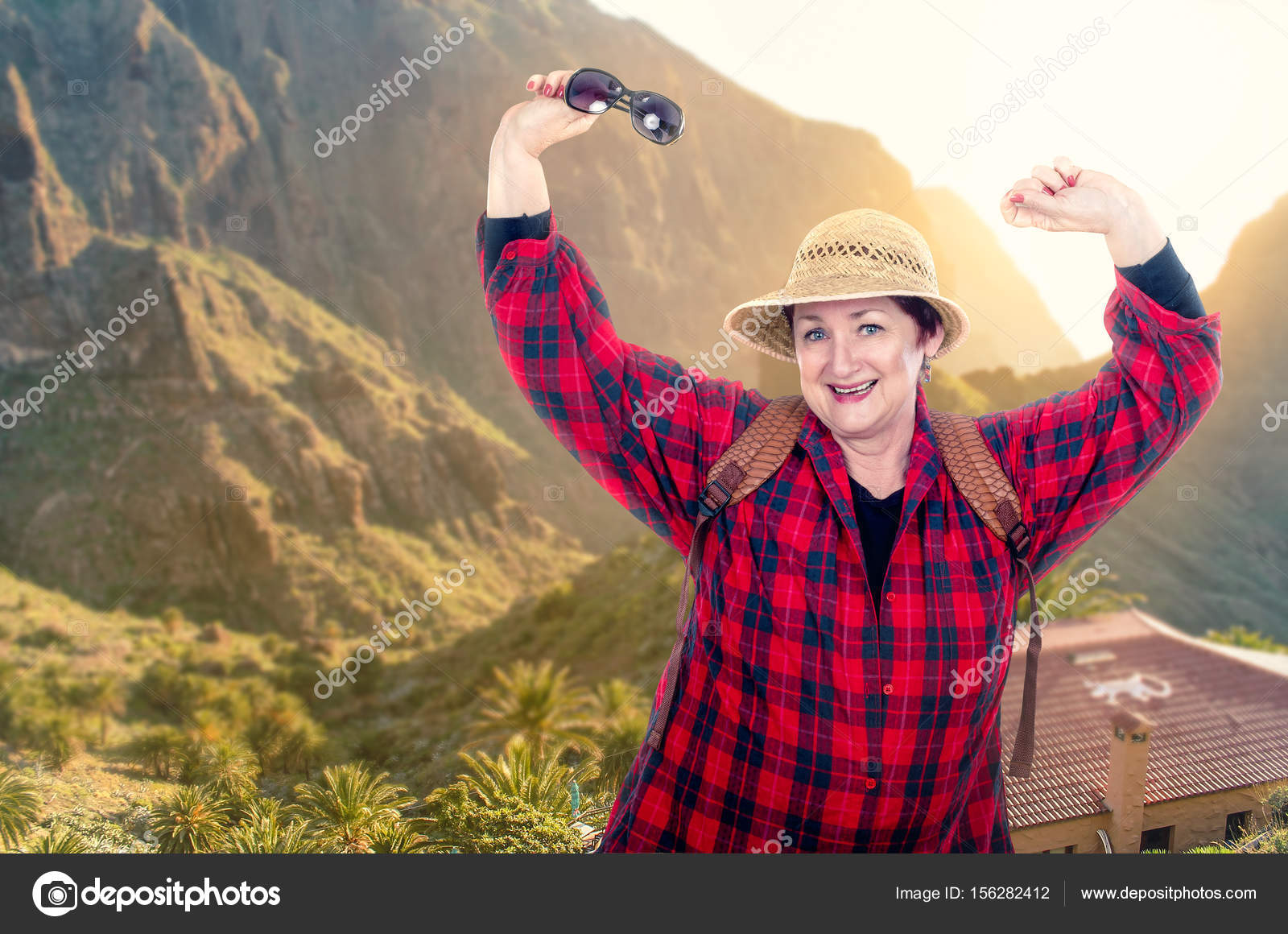 Lively backpacking older woman posing on mountains background — Stock ...