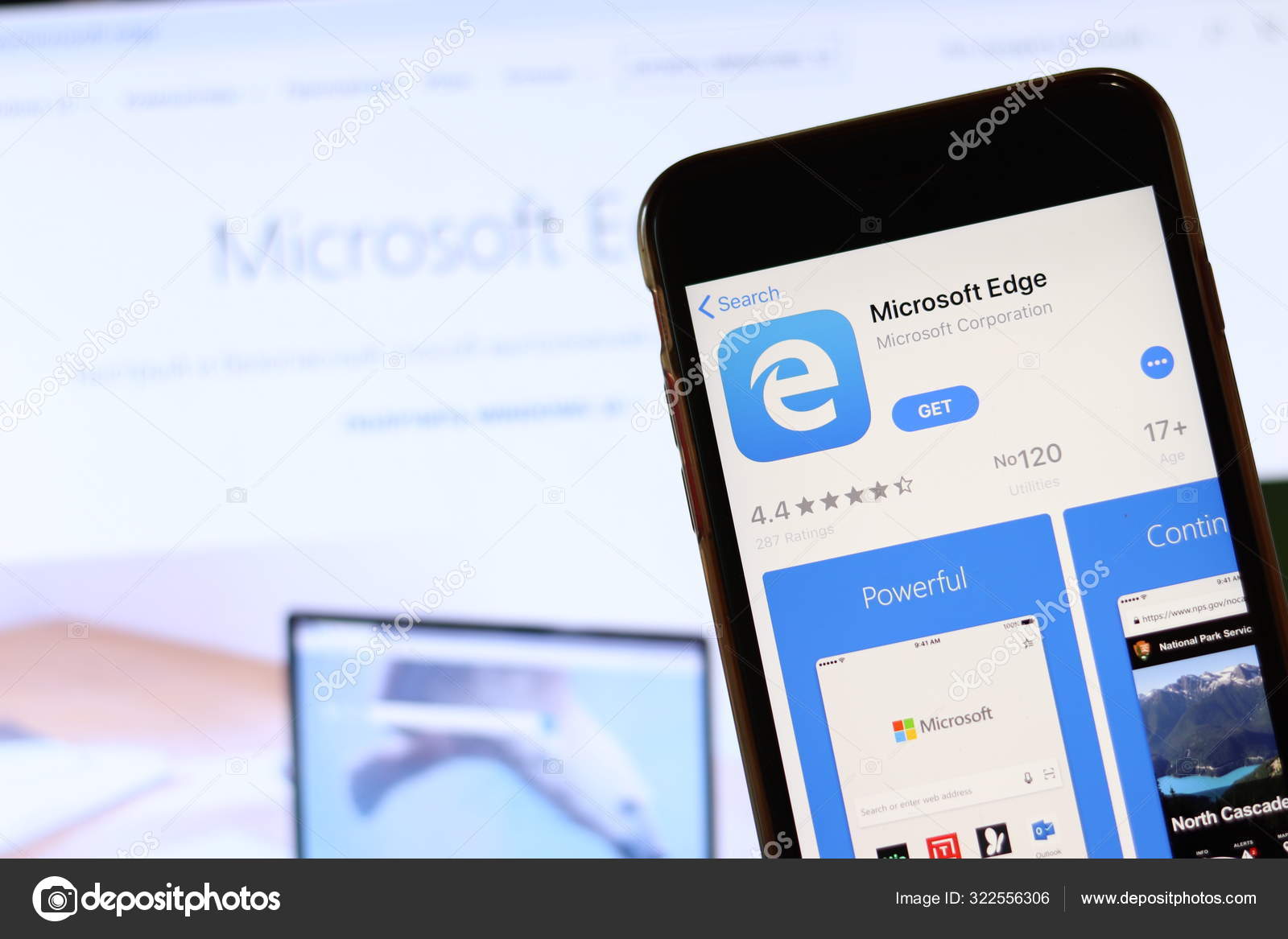 Phone with Microsoft Edge icon on screen close up with blur website on ...