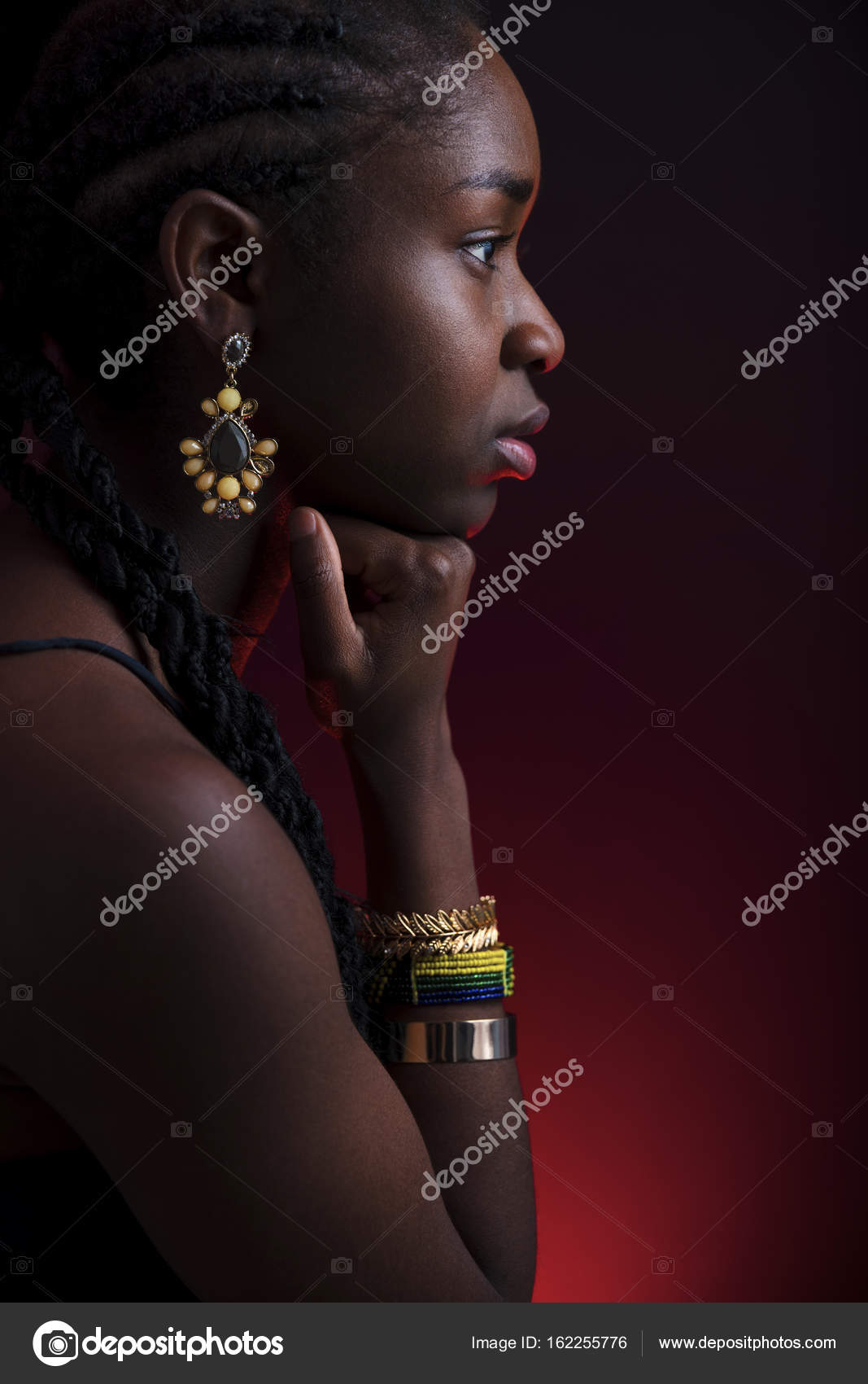 Colorful and creative side view portrait of african woman with dark ...