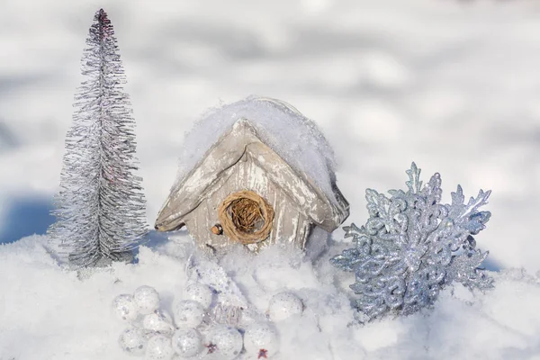 A birdhouse, a house for birds in the snow with a Christmas tree and a ...