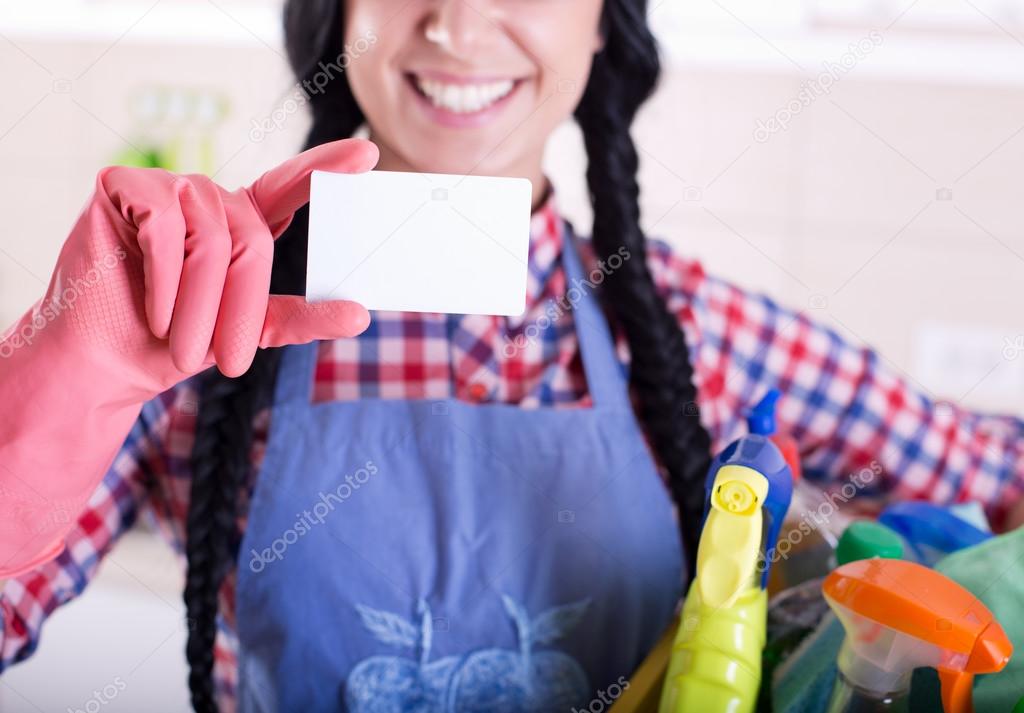 Cleaning lady showing businesscard Stock Photo by ©budabar 128167944