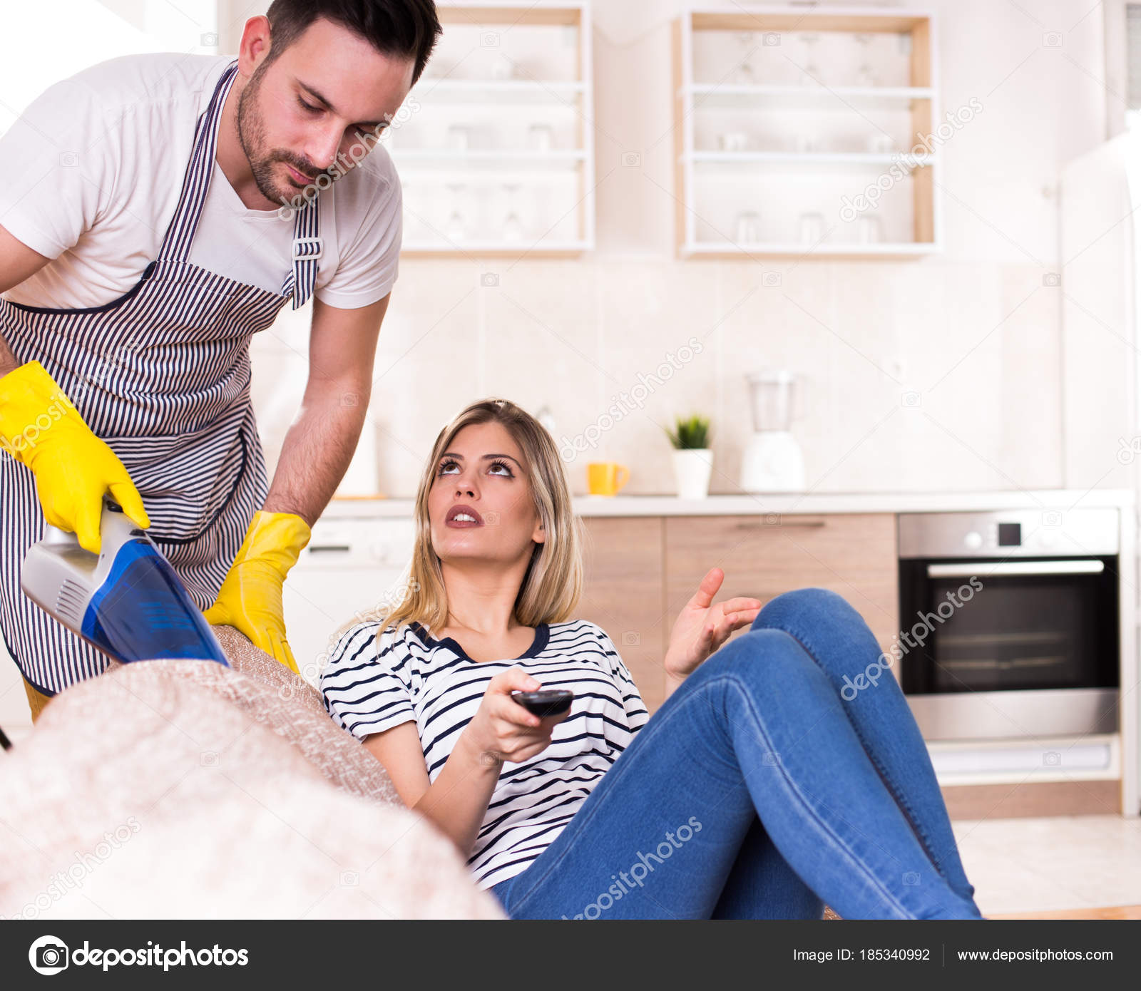 Husband doing housework while wife resting Stock Photo by ©budabar ...