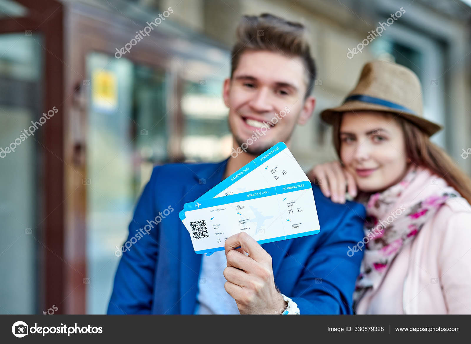 Happy cheerful couple hugging and showing flying tickets. man making a ...