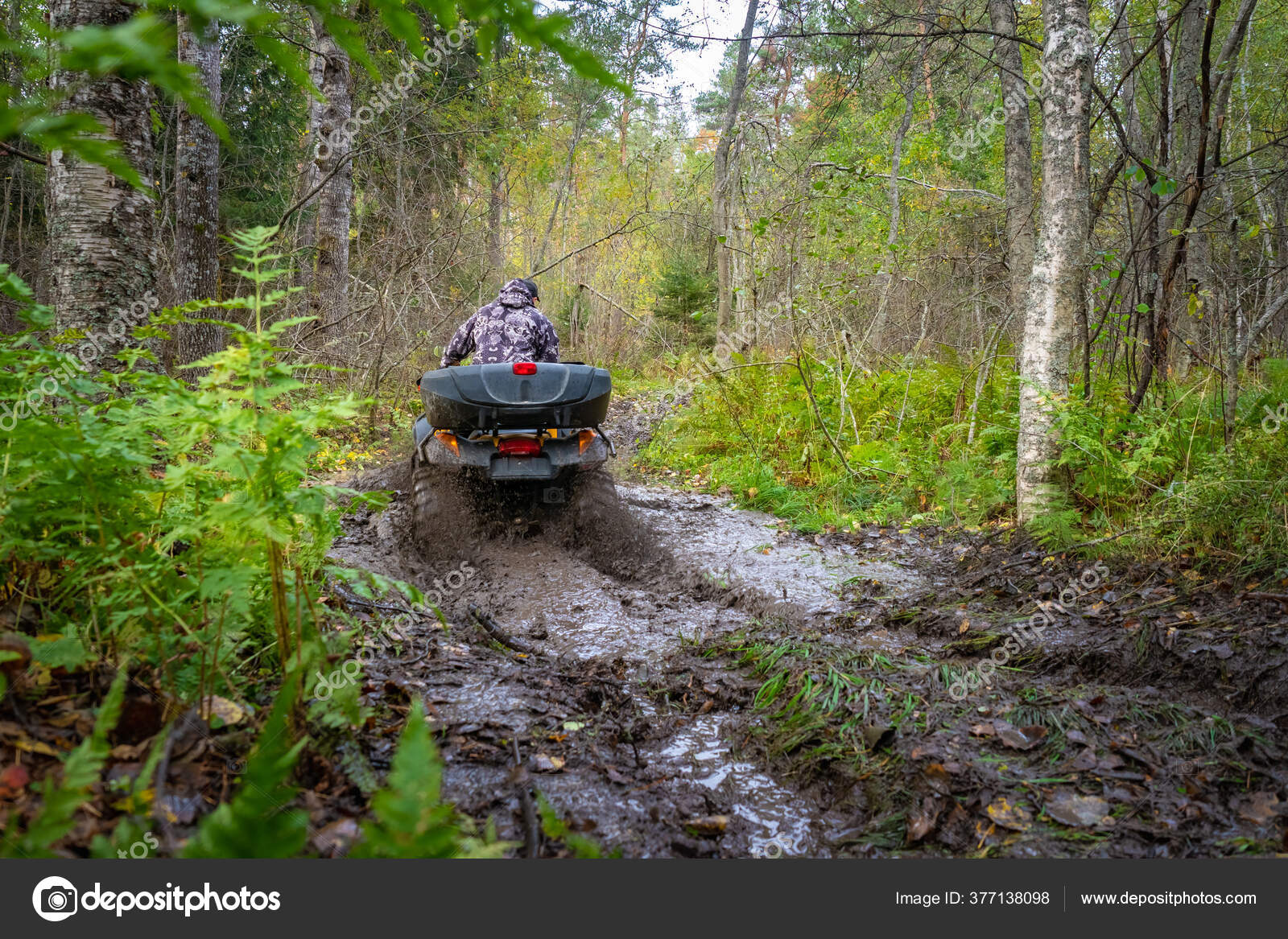 Man Rides Atv Rear View Riding Quadrocycle Mud Road Travel Stock Photo ...