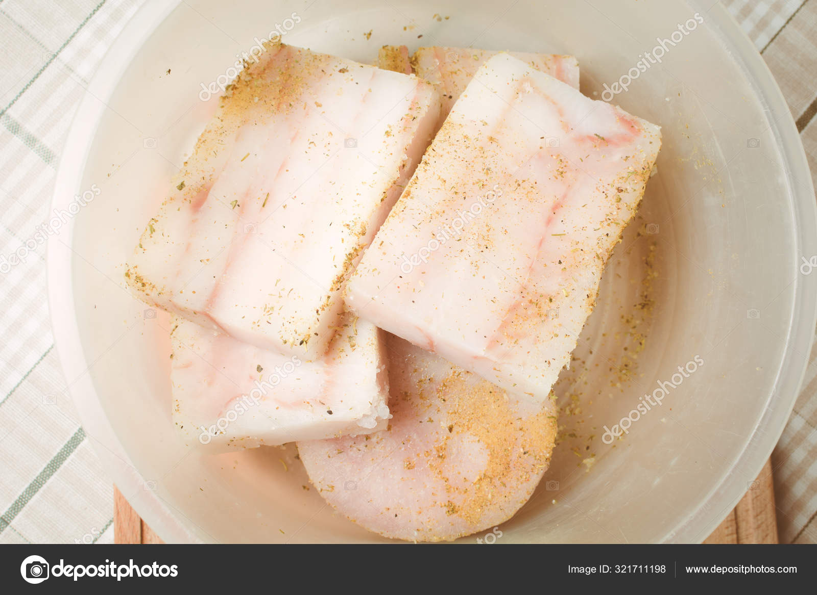 Raw fillet of mintai fish marinated in deep egg pan for cooking. Stock Photo by ©Tagwaran 321711198