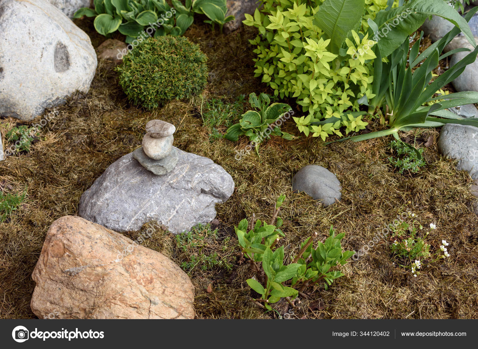 Lined pyramid of river stones in the garden. Stock Photo by ©Tagwaran ...
