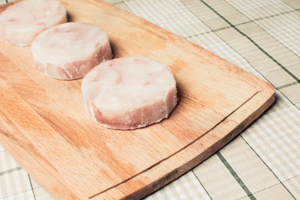 Raw fillet of mintai fish marinated in deep egg pan for cooking. Stock ...