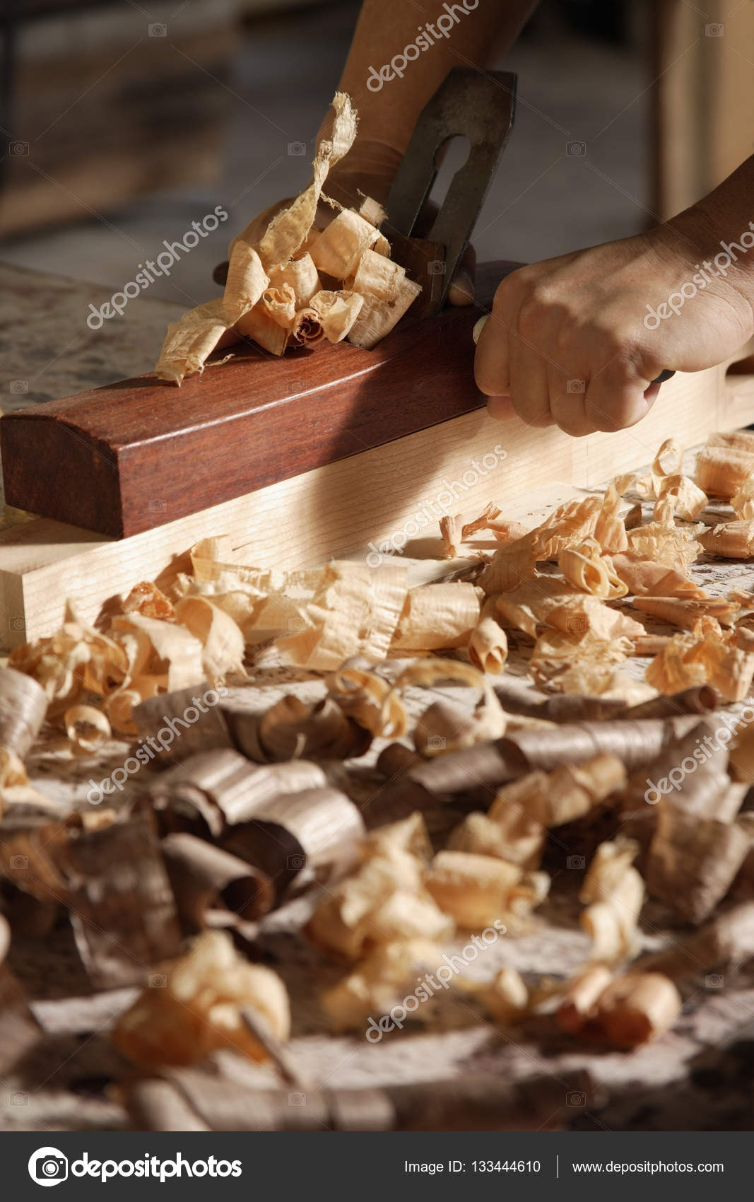 Carpenter using a block plane. Stock Photo by ©MicrostockAsia 133444610