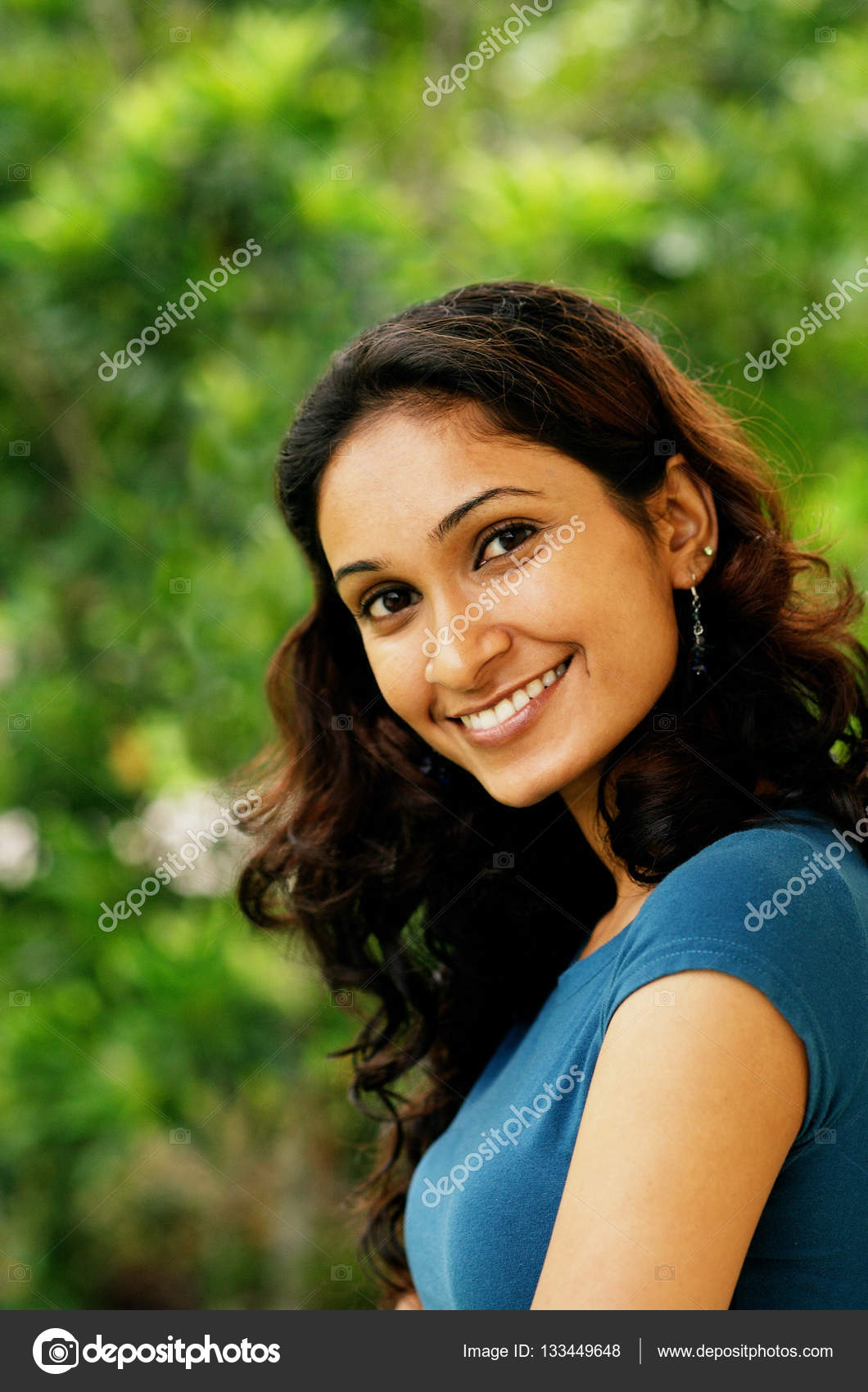 Woman smiling at camera — Stock Photo © MicrostockAsia #133449648