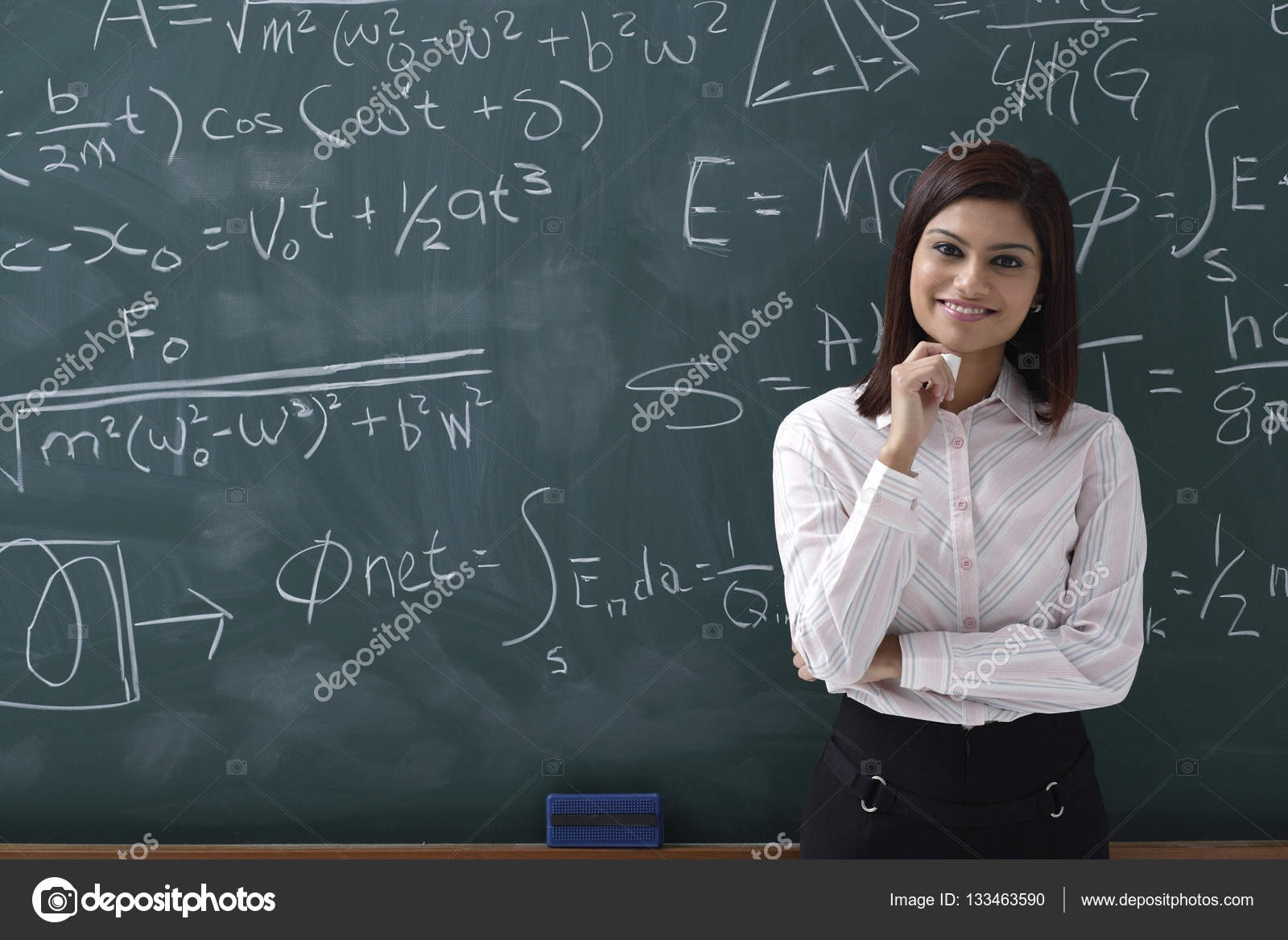 Teacher against chalk board — Stock Photo © MicrostockAsia #133463590
