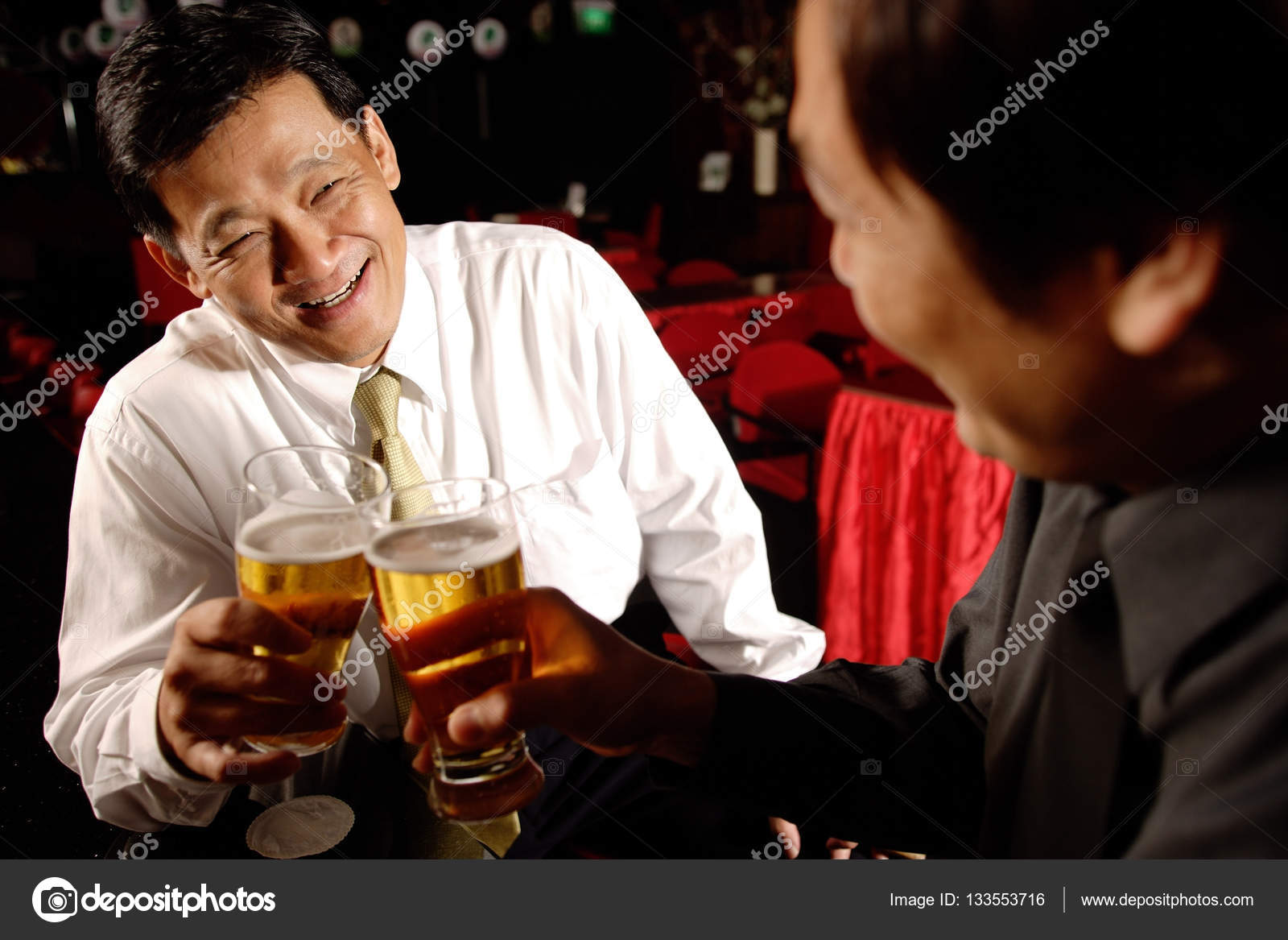 Two men drinking beer Stock Photo by ©MicrostockAsia 133553716