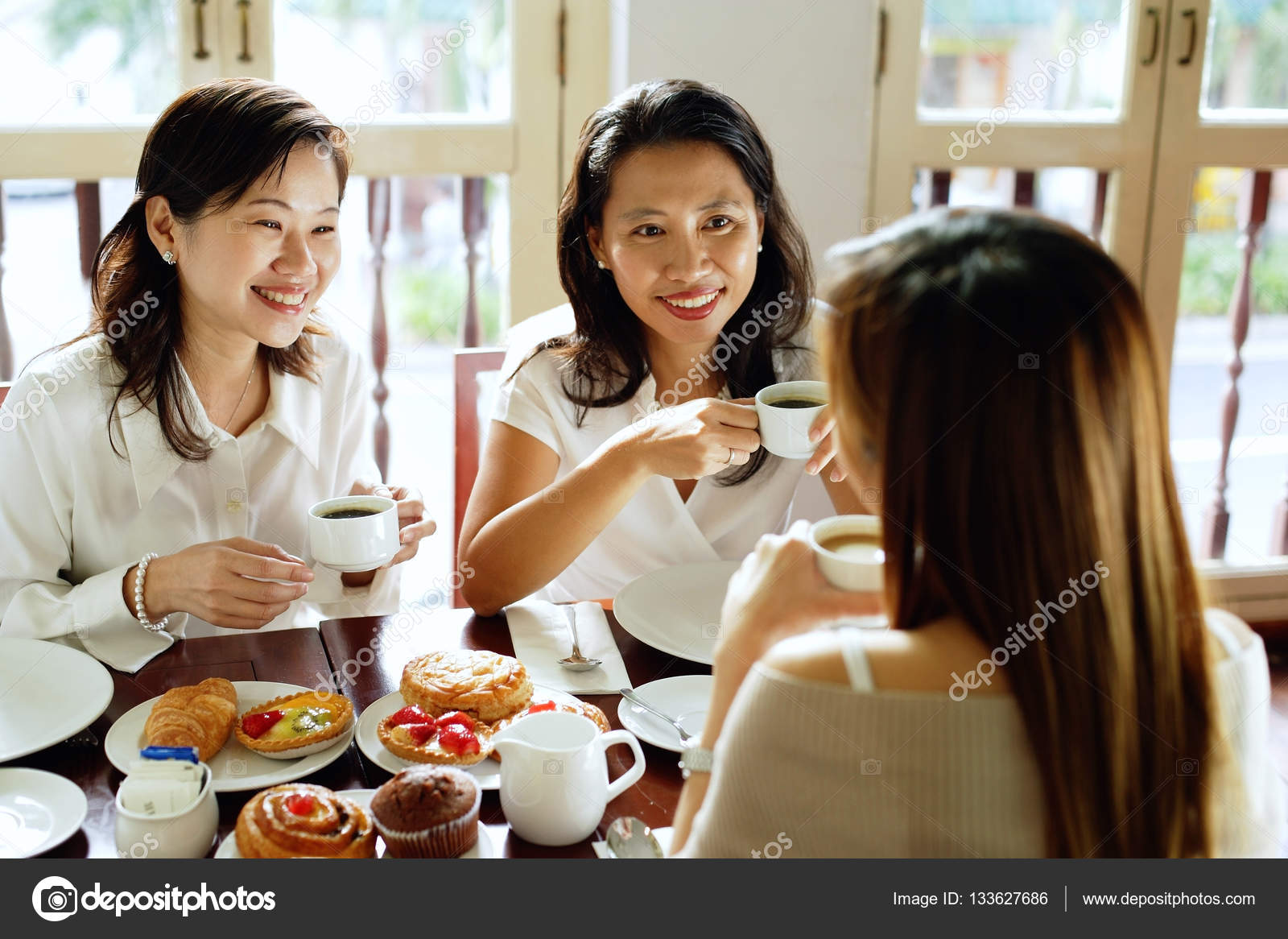 Women having tea — Stock Photo © MicrostockAsia #133627686