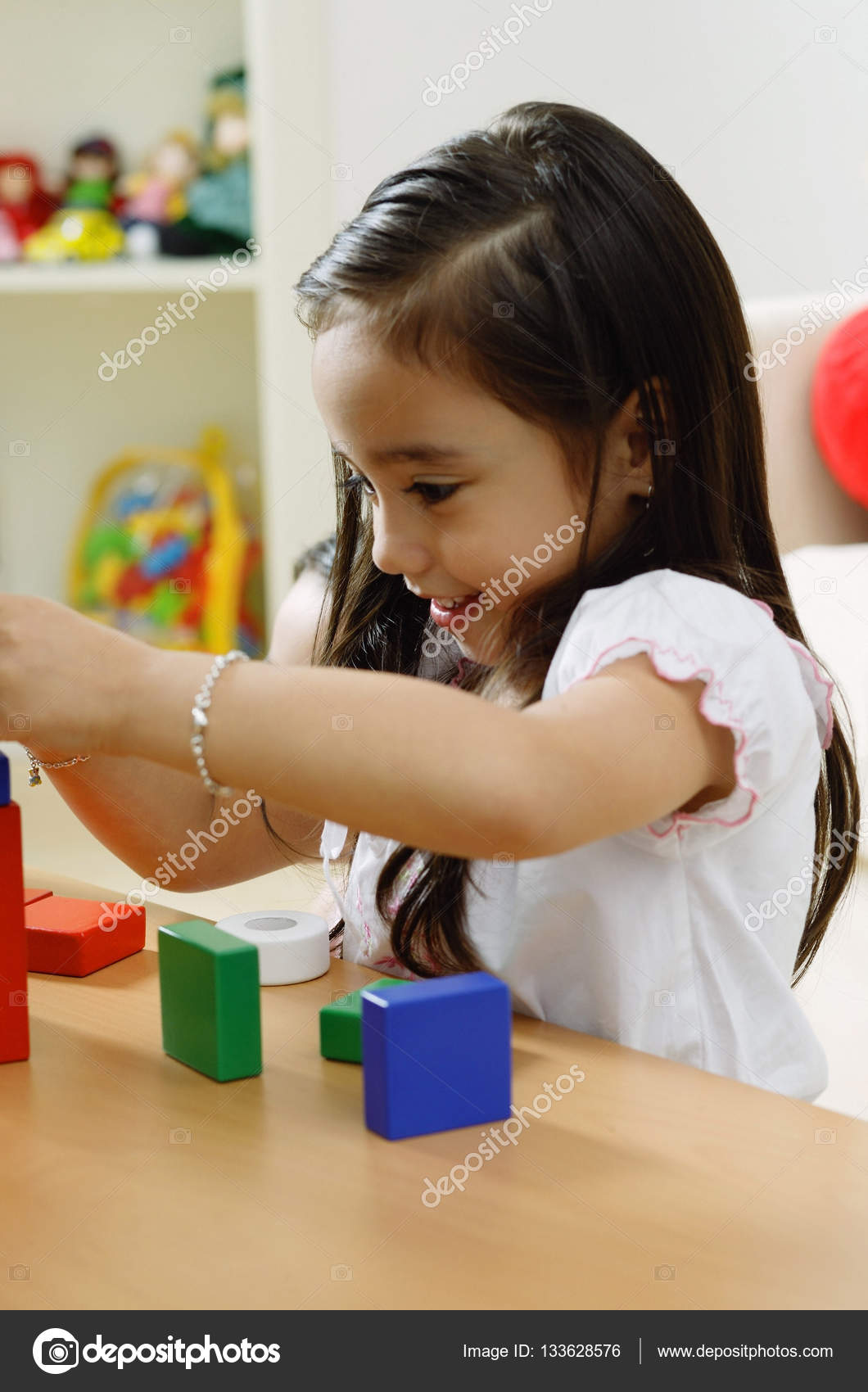 Girl playing with blocks Stock Photo by ©MicrostockAsia 133628576