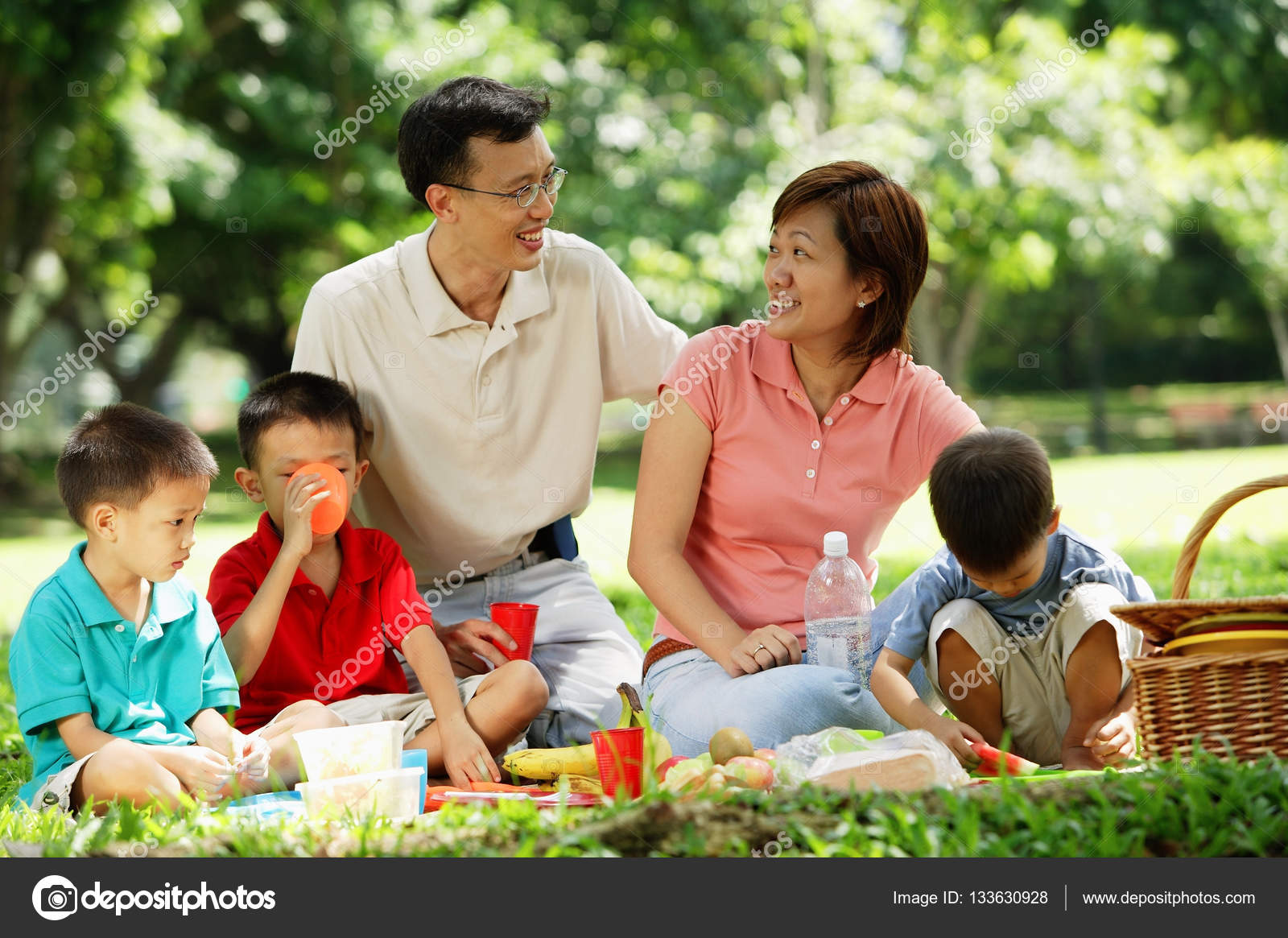 Family with three boys on picnic — Stock Photo © MicrostockAsia #133630928