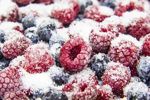 A Berry mix in sugar from frozen raspberries and blueberries. A Frozen ...