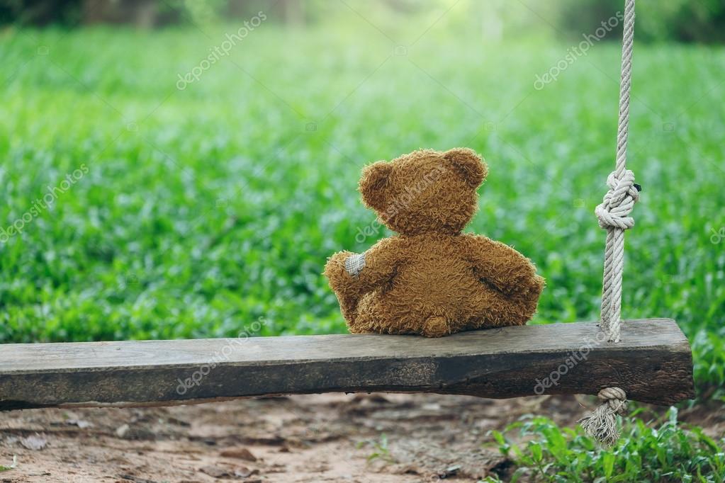 Cute Teddy bears sitting on a swing Stock Photo by ©sukr13 126003176