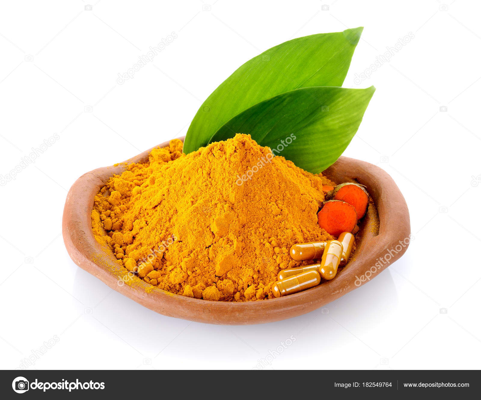 Turmeric powder and turmeric capsules on white background Stock Photo ...
