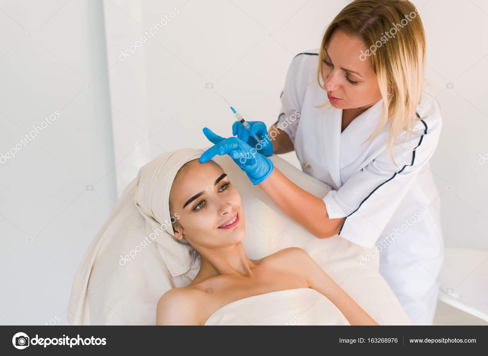 Doctor making botox facial injection. Stock Photo by ©160275 163268976