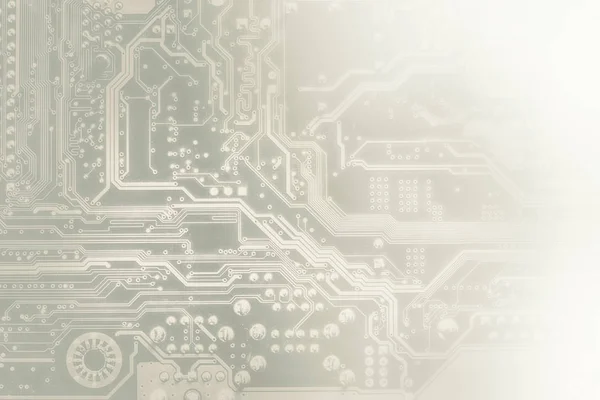 Circuit board toned into light grey. Electronic computer hardware ...