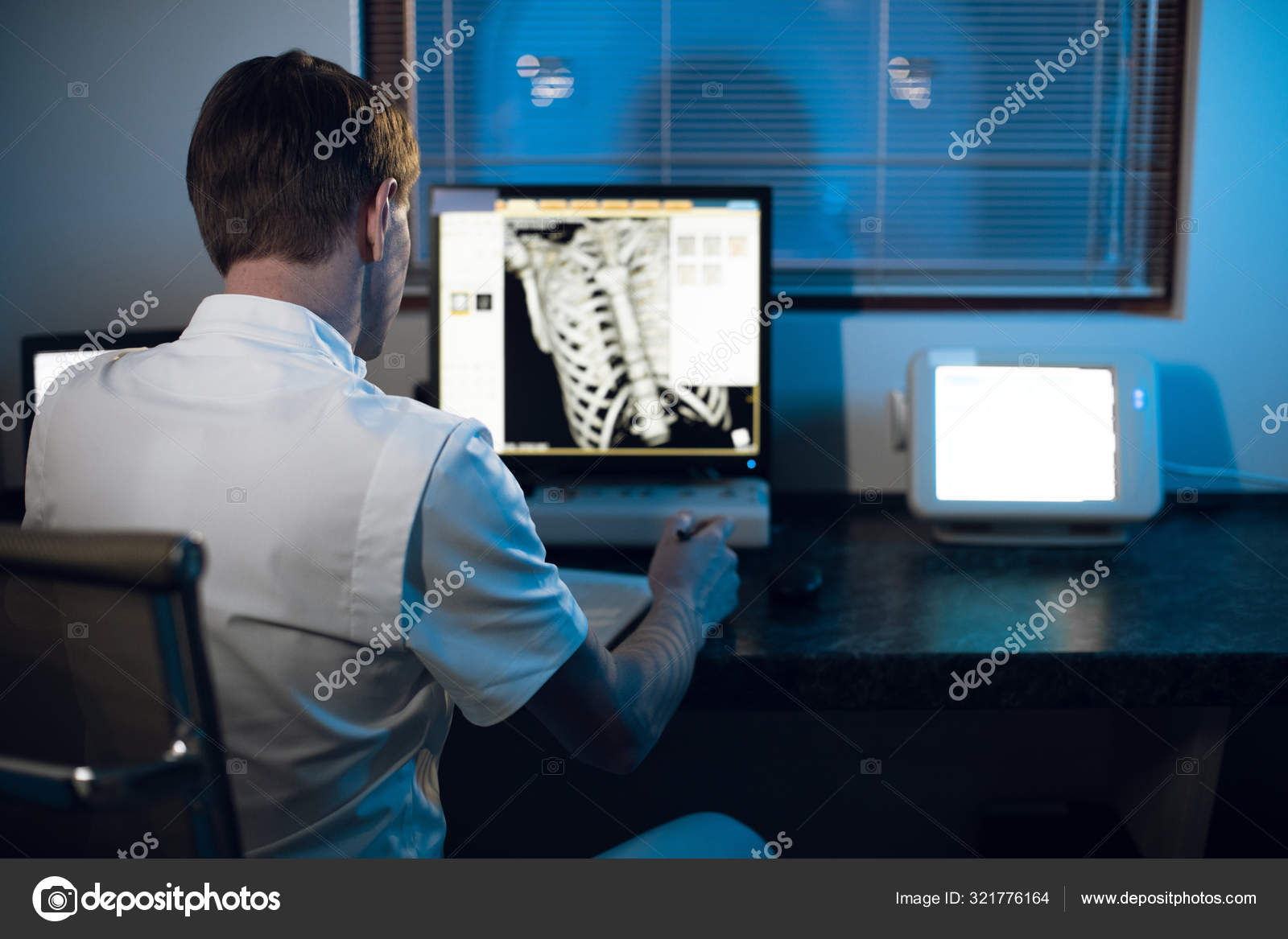In medical laboratory patient undergoes MRI or CT scan process under ...
