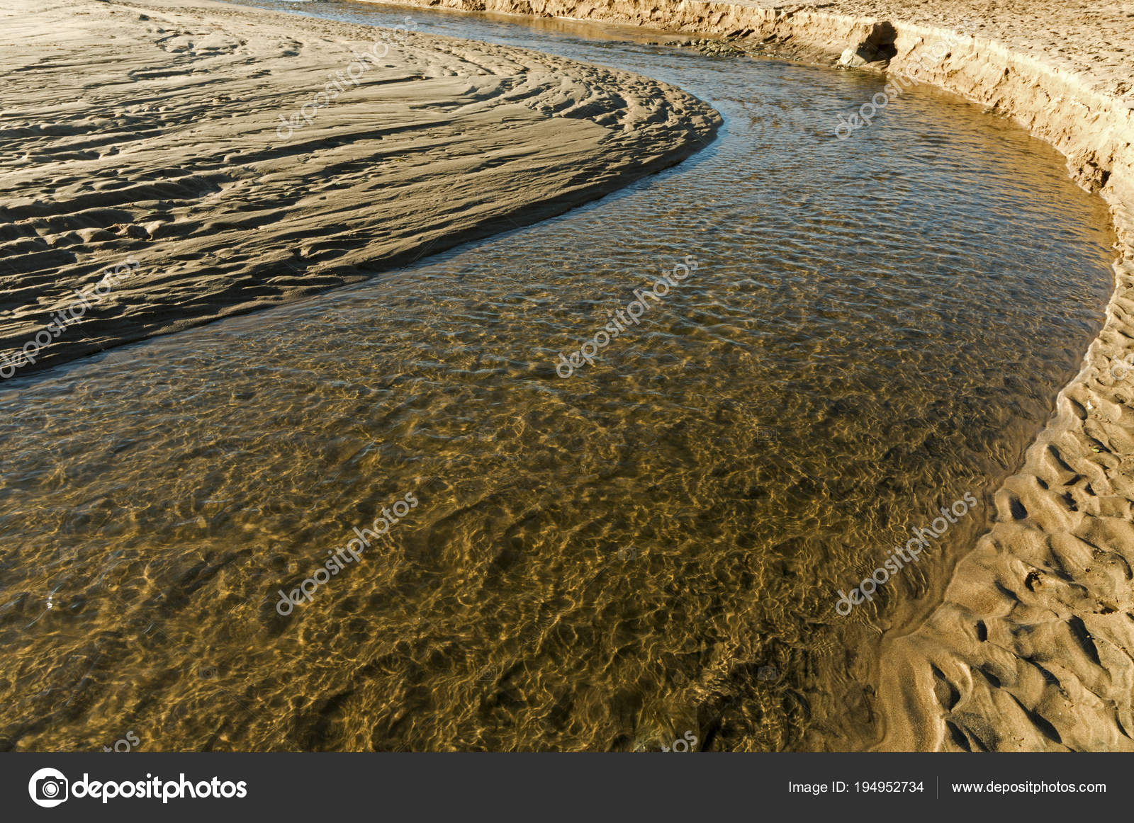 Estuary Rippled Water Flowing Through Golden Beach Sand Stock Photo by ...