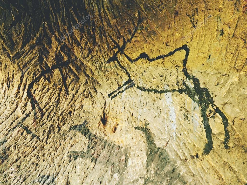 Caveman symbols on sandstone wall. Paint of human hunting, prehistoric ...