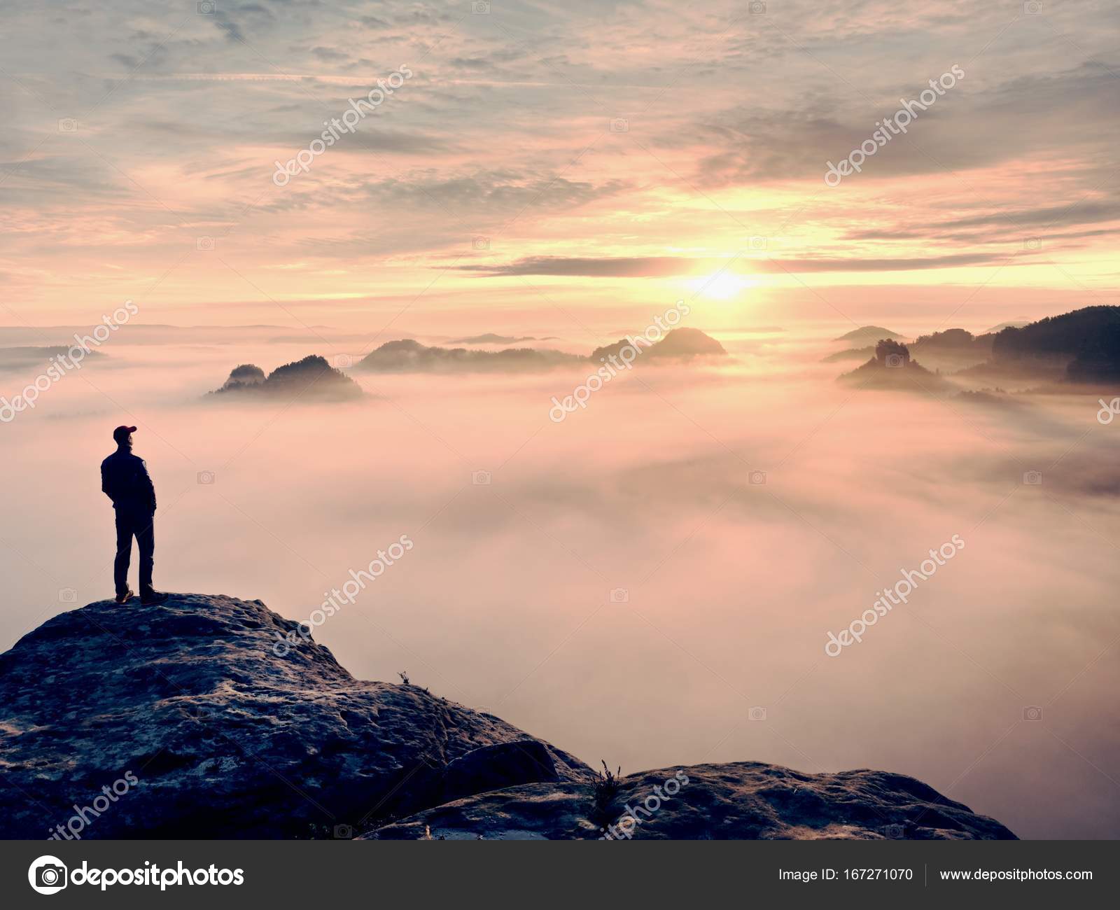Man Standing Alone On Cliff