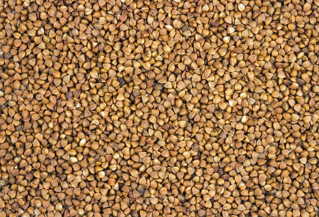 Grano de trigo sarraceno crudo. Textura o fondo alimenticio 2022