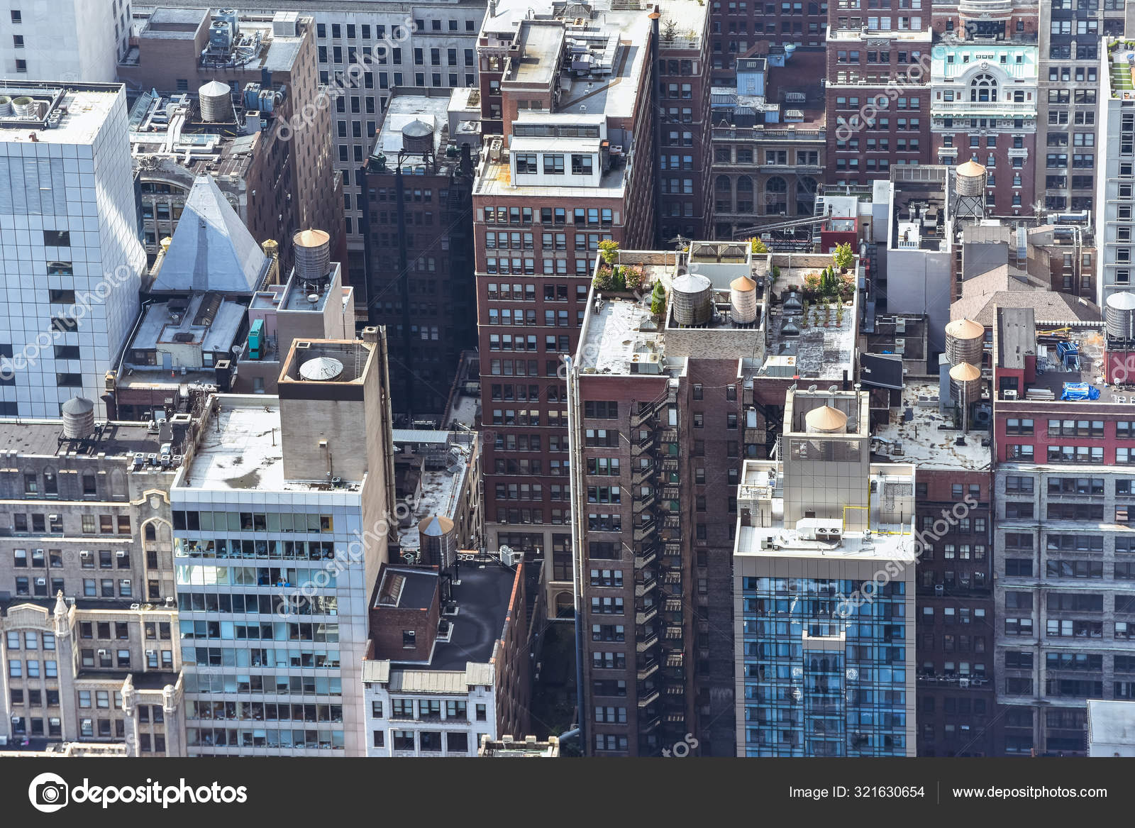 Aerial close up view of crowded buildings in New York City on a sunny ...