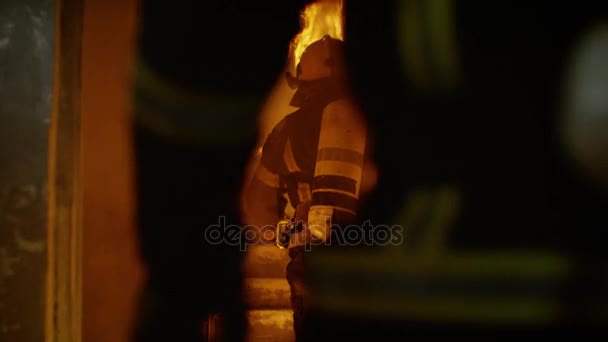 Portrait of a Brave Firefighter Standing in a Burning Building. Raging ...