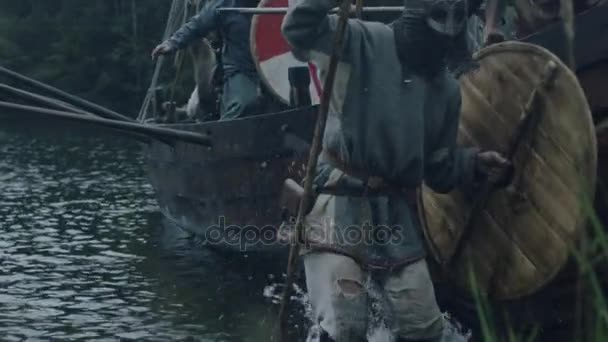 Viking Warriors Jump off the Row Ship after Arriving to Shore. Slavs ...