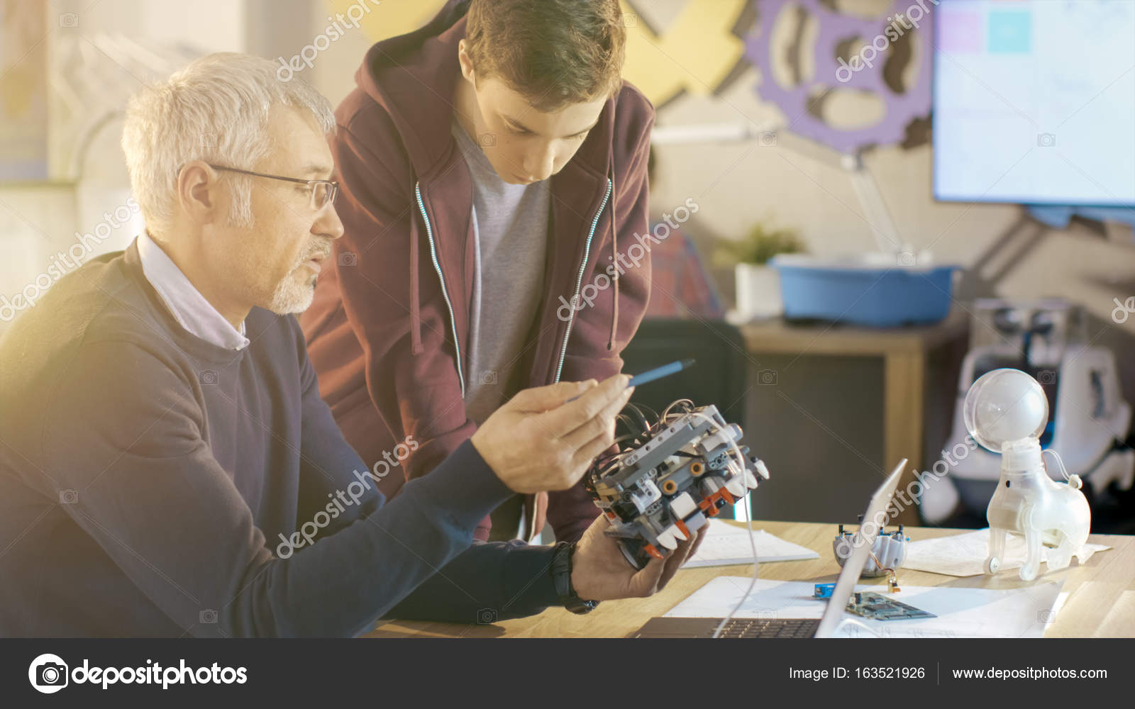 In Computer Science Class Teacher Examines programed Robot Engin Stock ...