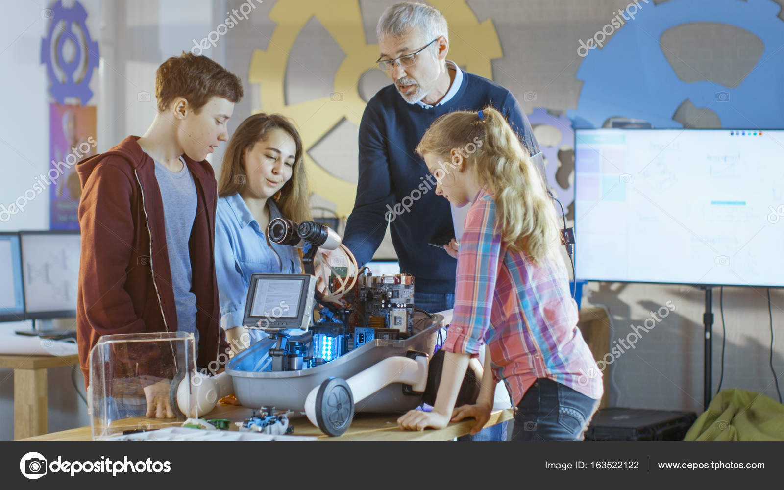 Teacher and His Pupils Work on a Programable Robot with LED Illu Stock ...