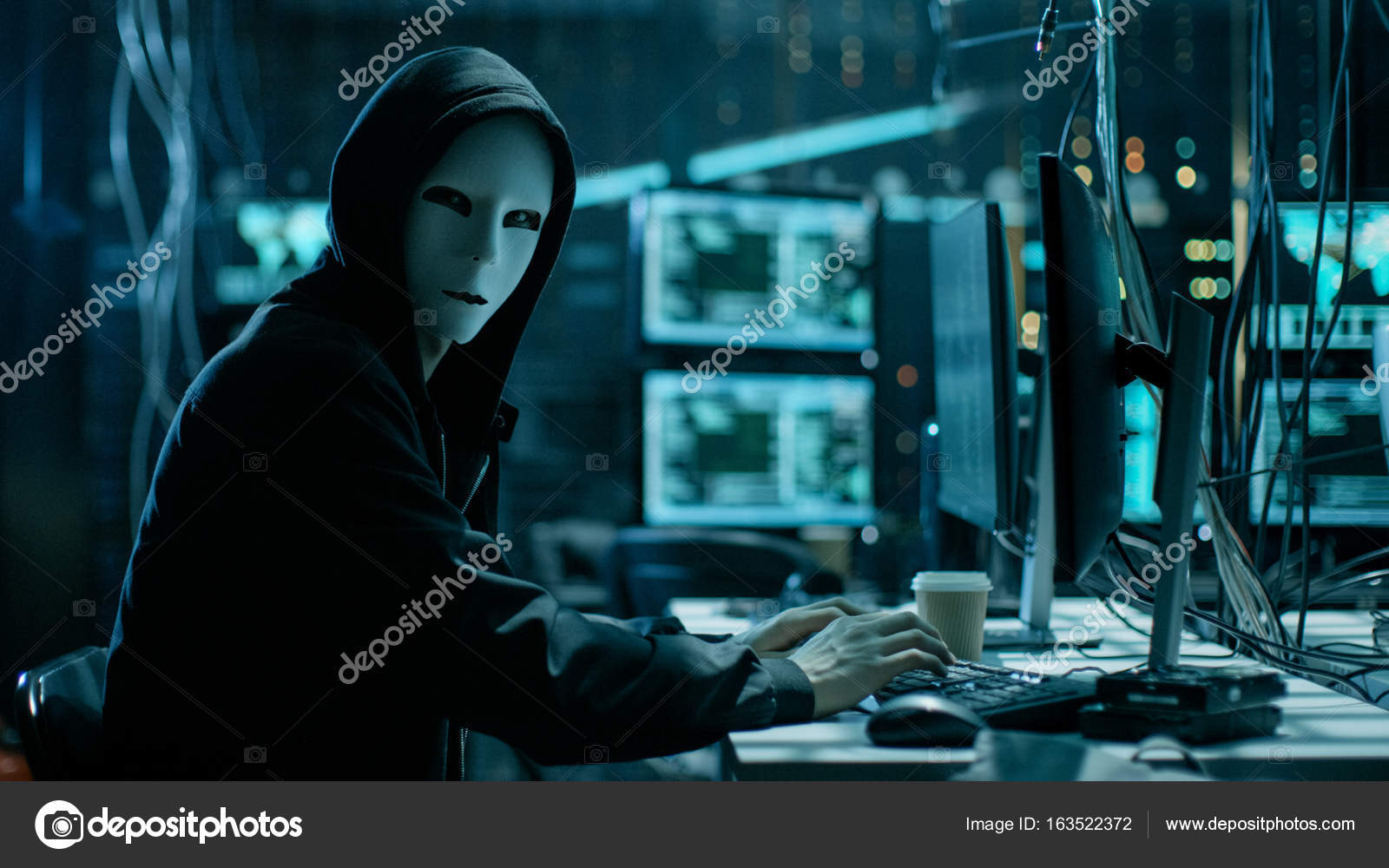 Masked Hacker is Using Computer for Organizing Massive Data Brea Stock ...