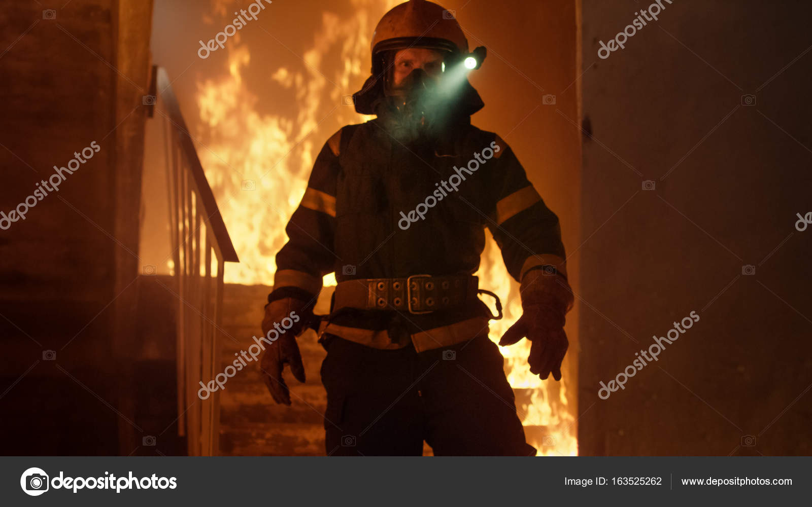 Brave Firefighter With Switched On Flashlight on His Helmet Stan ...