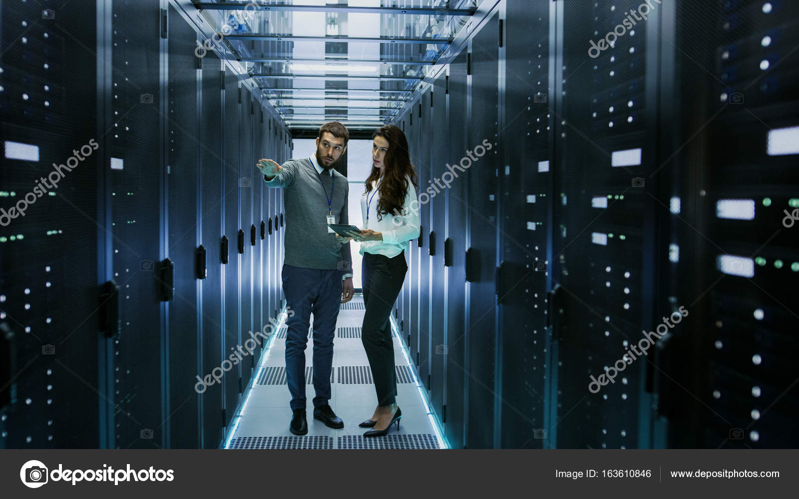 IT Engineer Shows Working Data Center / Server Room to Female Ch Stock ...