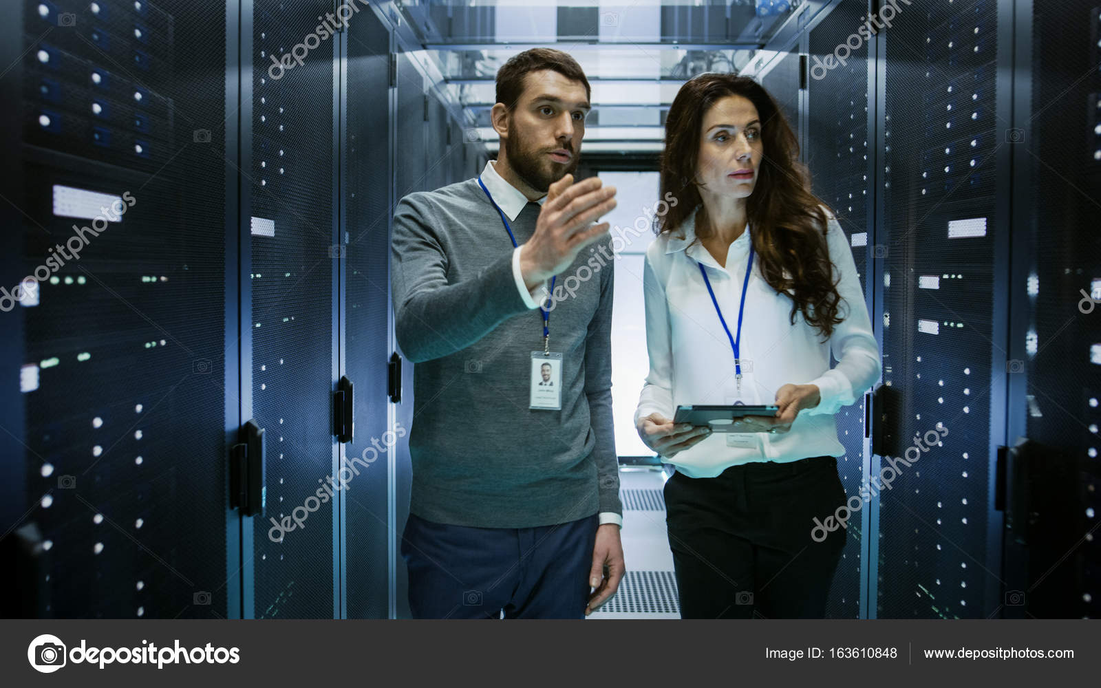 IT Engineer Shows Working Data Center / Server Room to Female Ch Stock ...