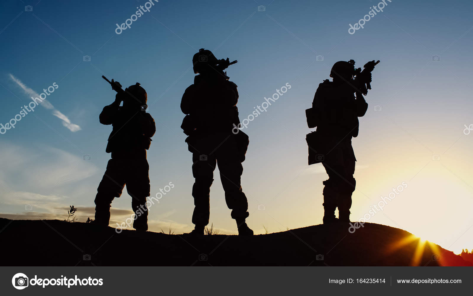 Squad of Three Fully Equipped and Armed Soldiers Standing in Des ...
