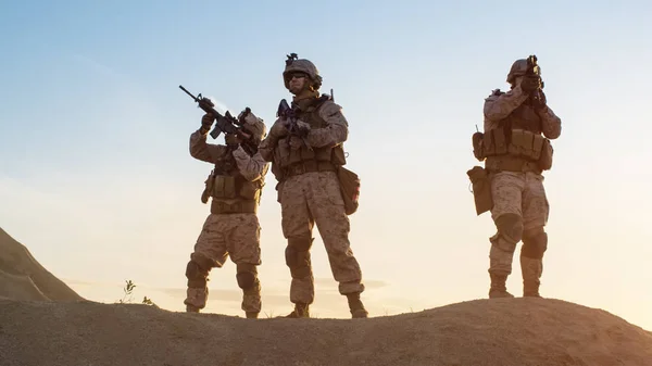 Squad of Three Fully Equipped and Armed Soldiers Standing on Hil Stock ...