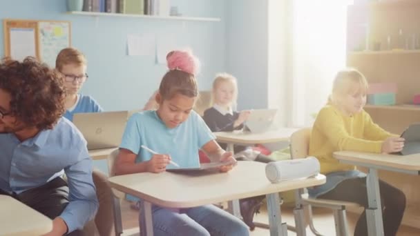 Elementary School Computer Science Class: Smart Boy Uses Digital Tablet ...