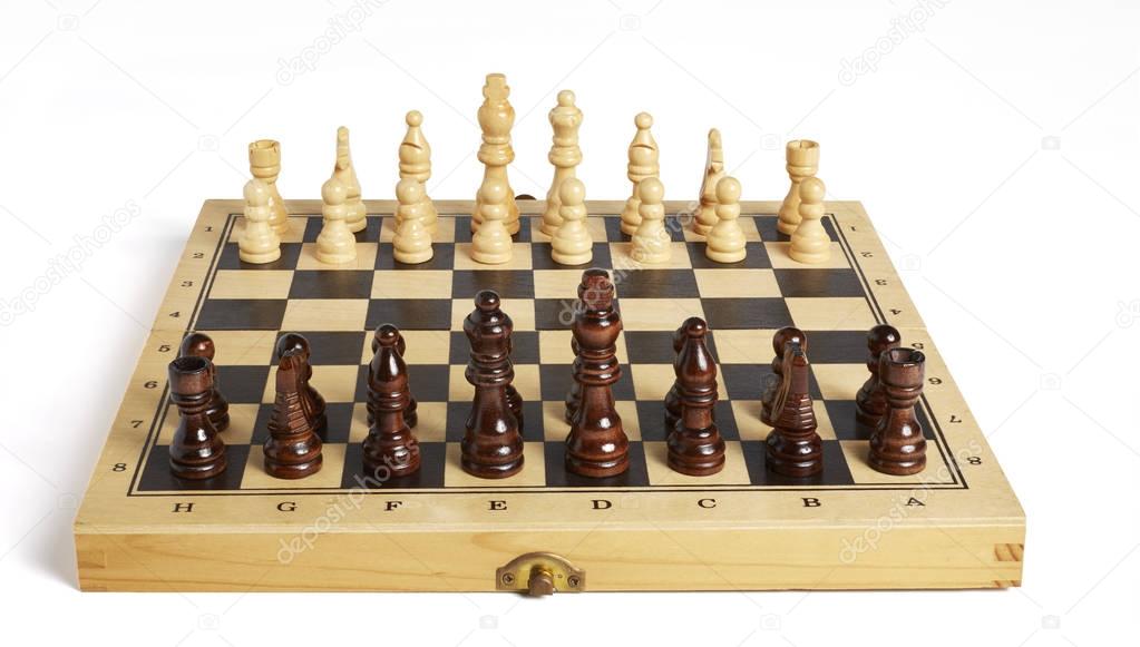 Wooden chess pieces on board frontal view — Stock Photo © Greatstock ...