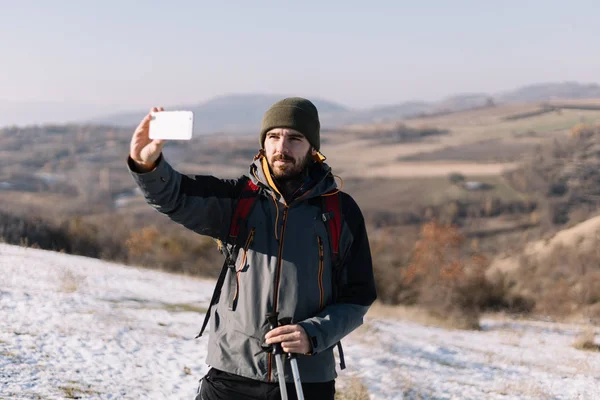 Tourist man taking selfie over the hills - Stock Image - Everypixel