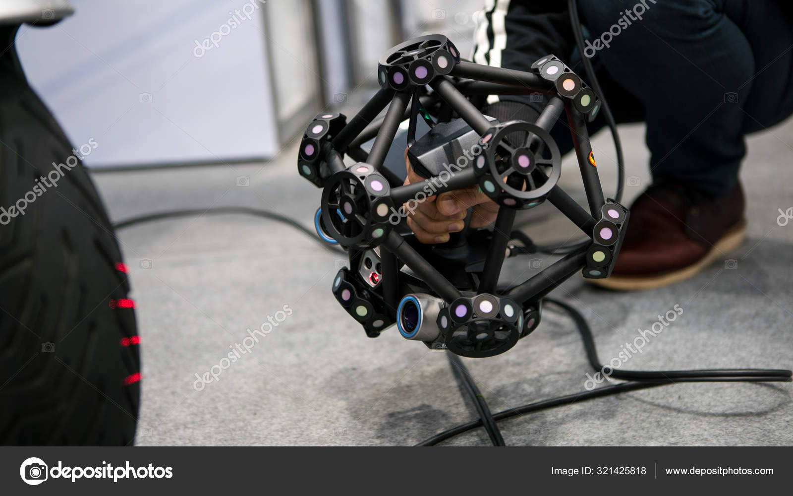 Man scanning a motorcycle using a measuring machine 3D scan high ...