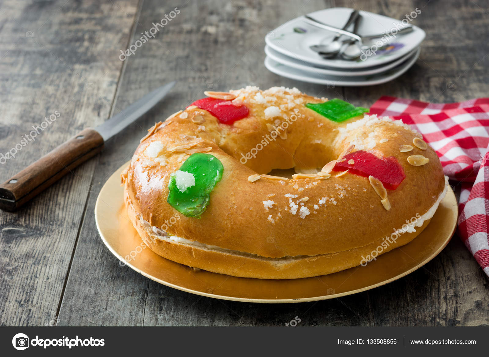 Spanish typical epiphany cake "Roscon de Reyes", on wooden background ...