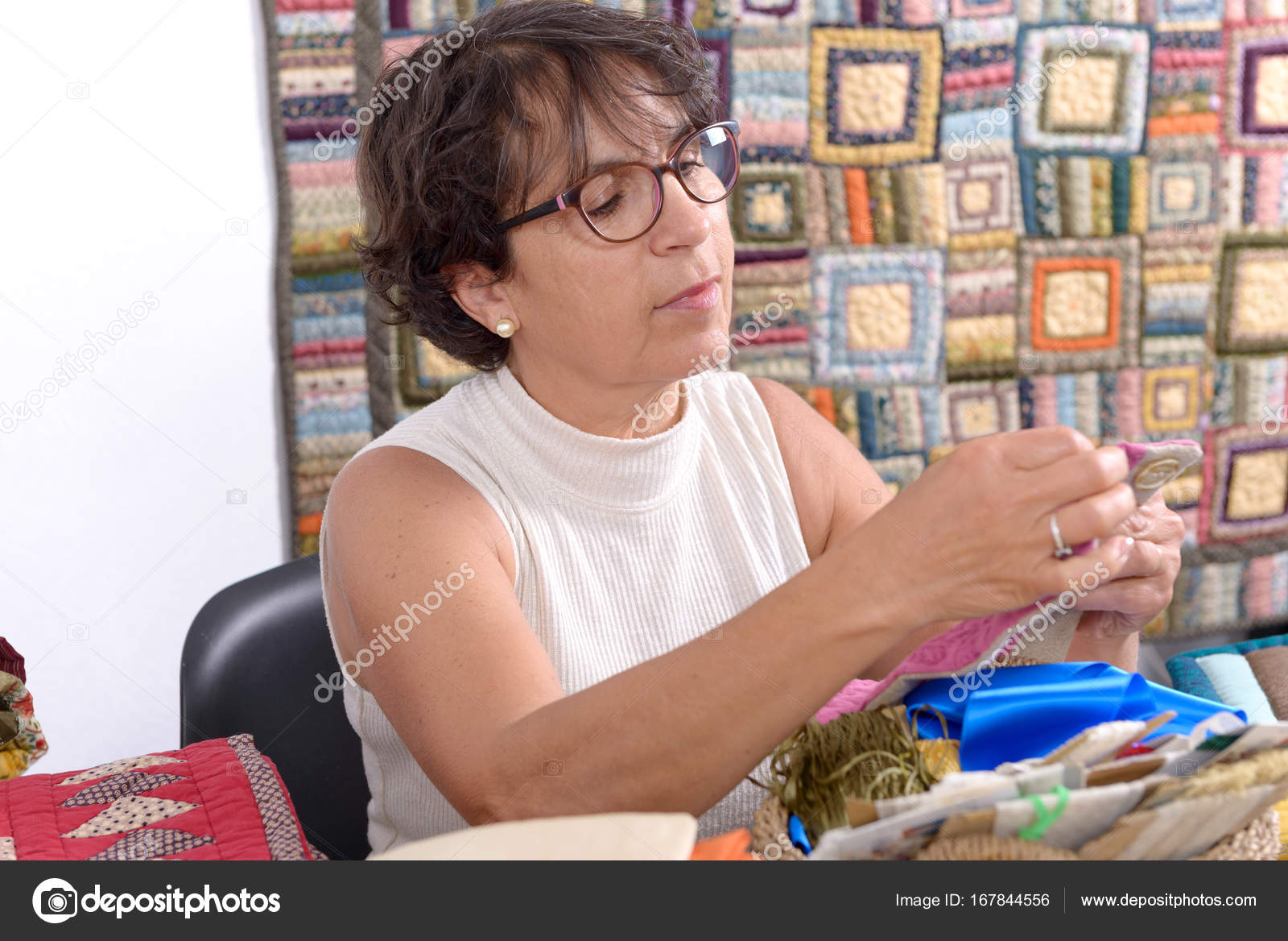Mature brunette woman sewing patchwork Stock Photo by ©philipimage ...