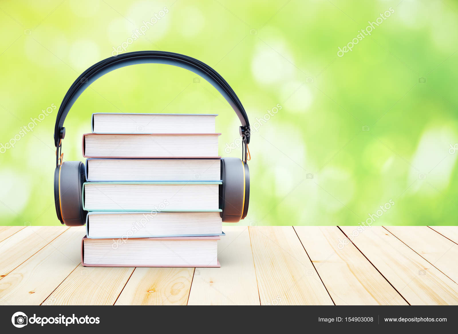 Book stack with headphones Stock Photo by ©peshkov 154903008