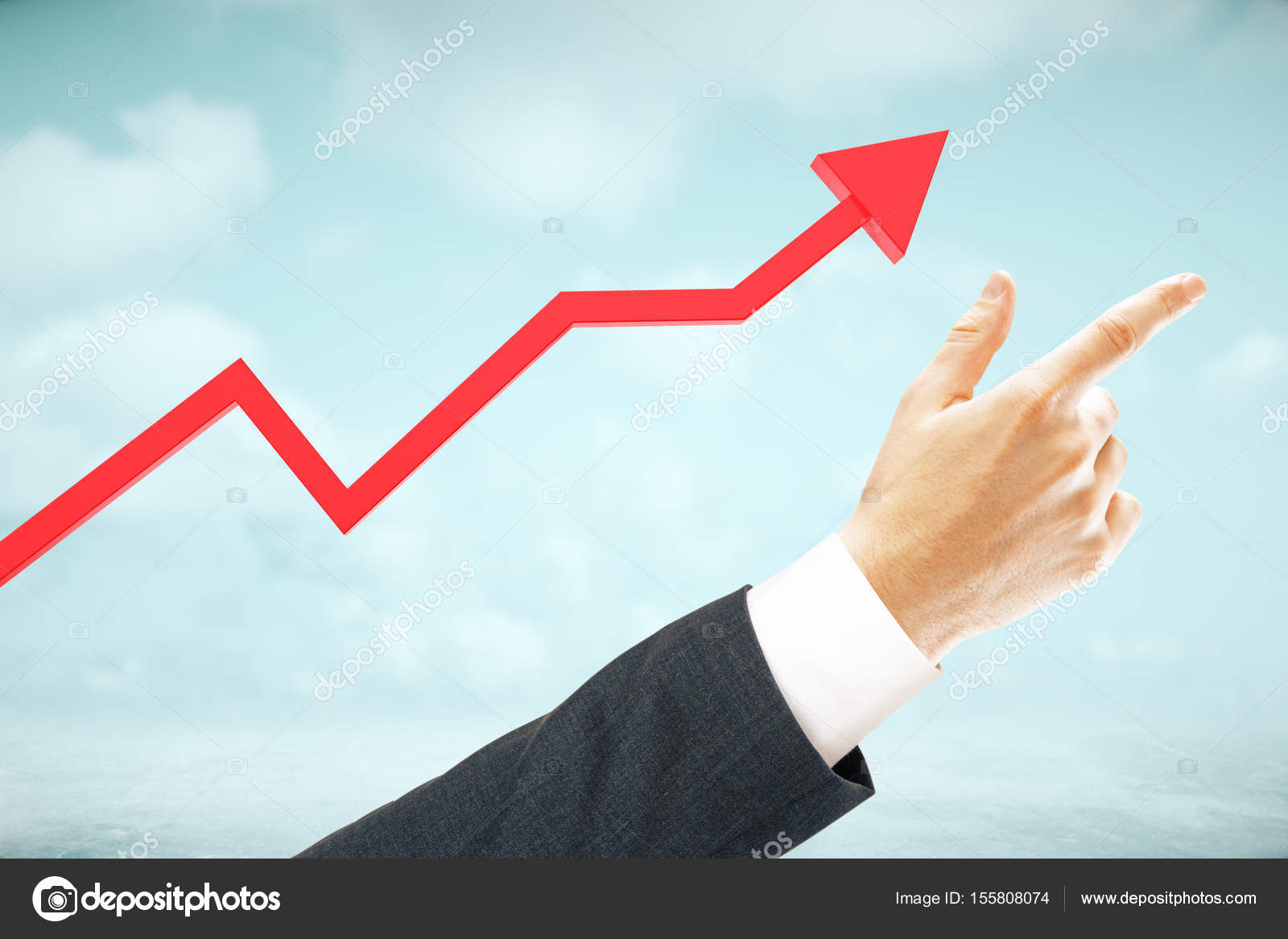 Red chart arrow and pointing businessman's hand on sky background ...