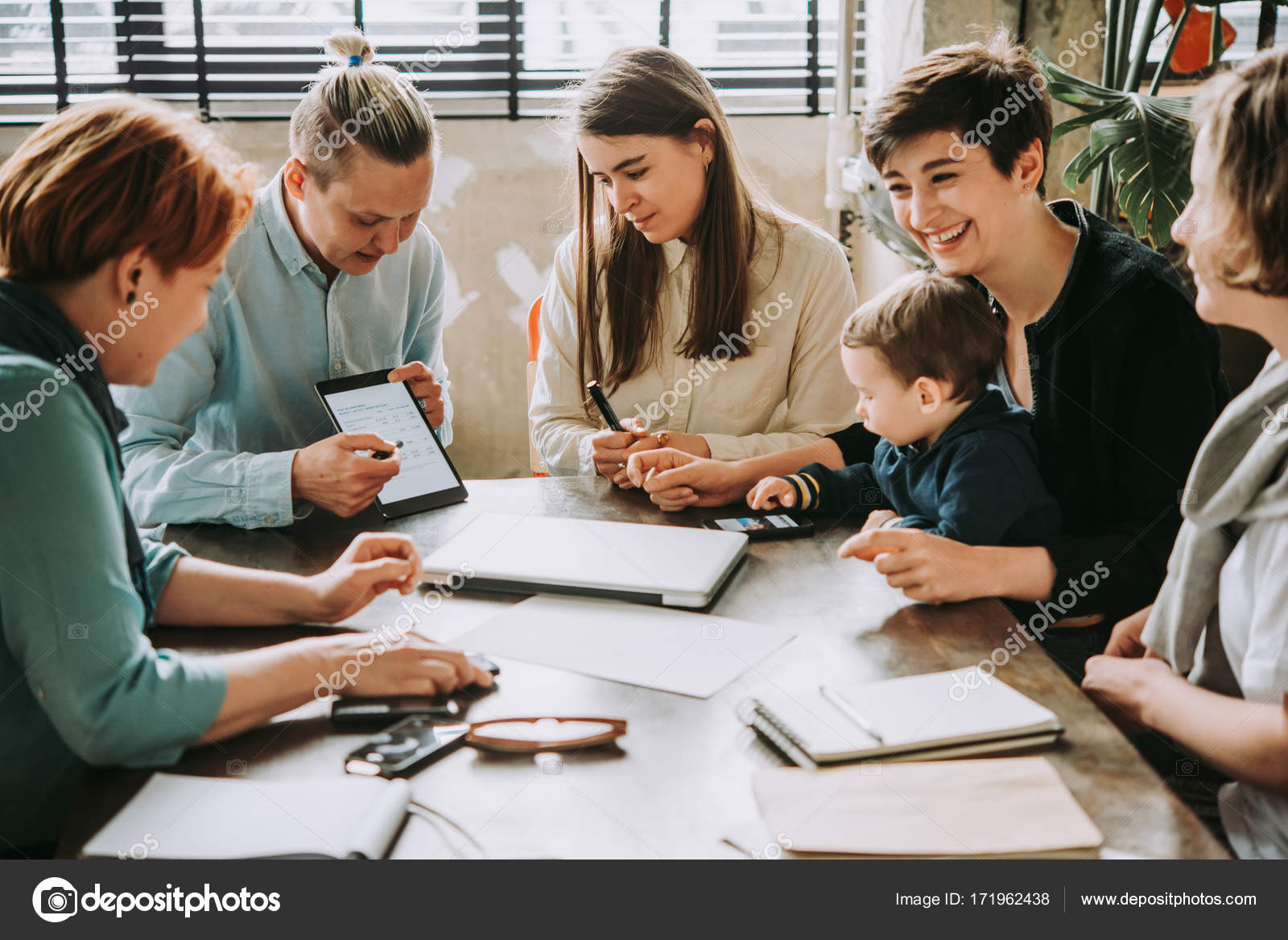 Young women in teamwork Stock Photo by ©gregorylee 171962438