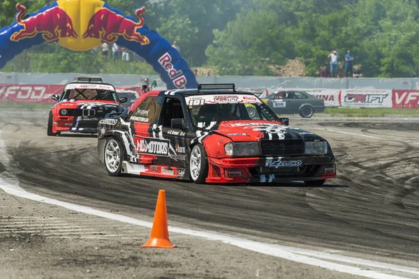 Unknown riders on the cars brand Nissan and GAZ-24 Volga overcom ...